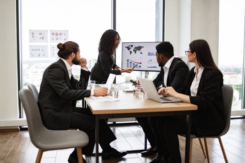 Diverse Business Team in Office Meeting Discussing a Presentation Stock ...