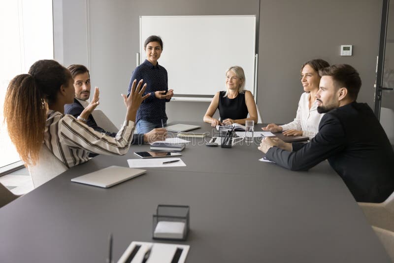 Diverse Business Team Talking at Meeting Table in Boardroom Stock Image ...
