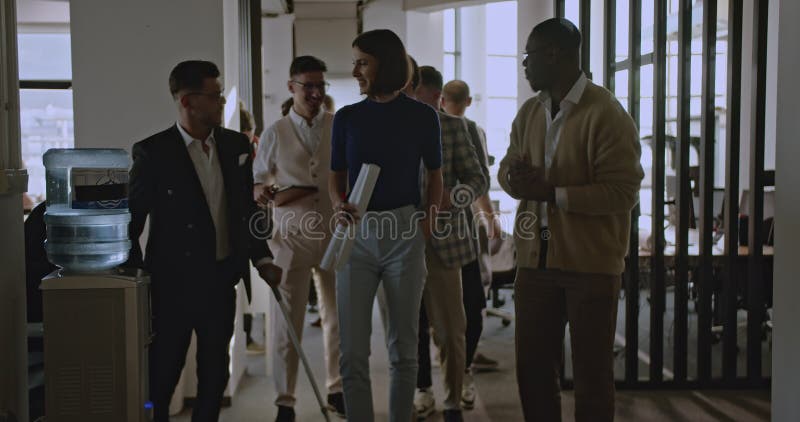 Diverse Business Team Collaboration in Modern Office: Walking, Talking, and Planning Future ...