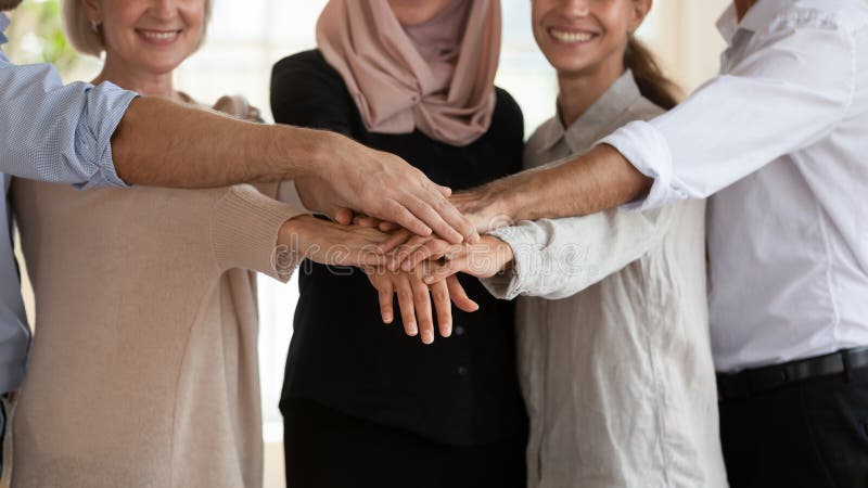 Diverse Businesspeople Stacked Palms Together Showing Unity and Amity ...