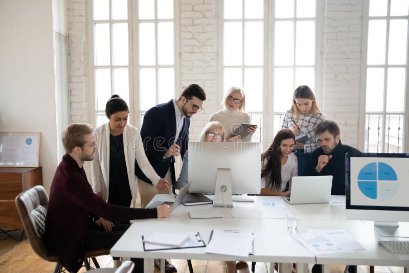 Diverse Businesspeople Work on Computers in Shared Office Stock Photo ...