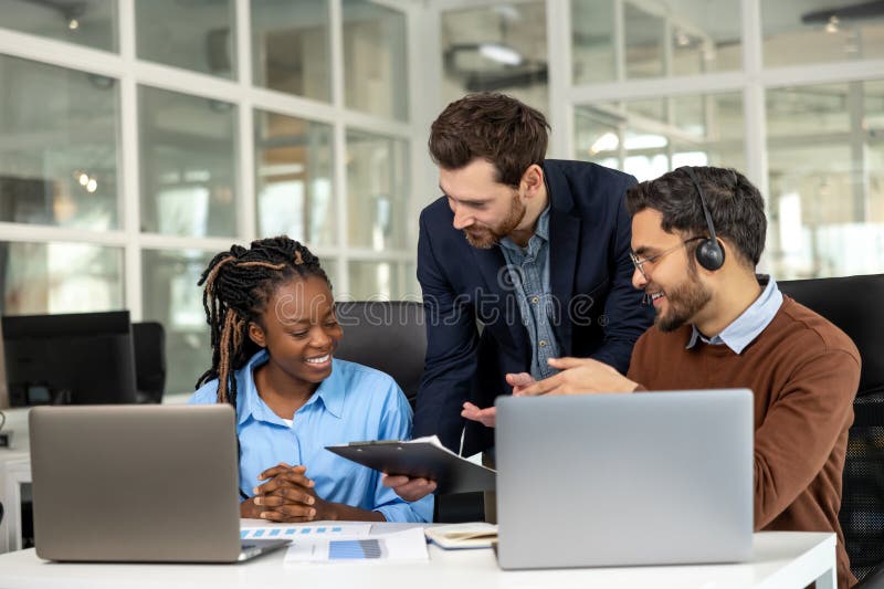 Diverse Colleagues Collaborating on Project Together Stock Image ...