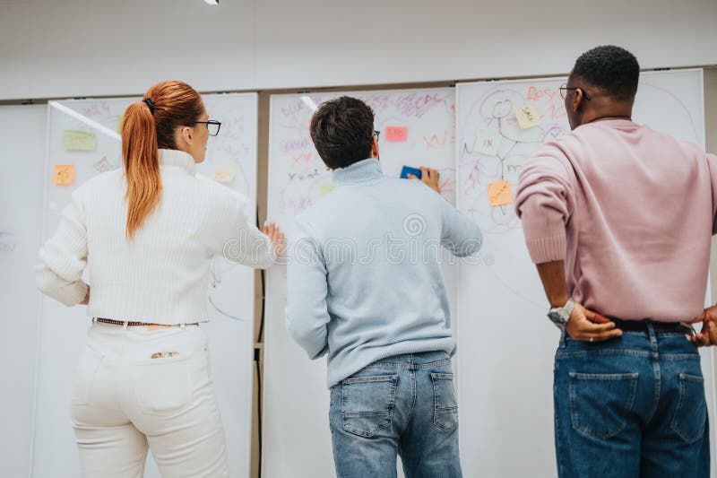 Diverse Colleagues in a Corporate Office Brainstorming Project Ideas ...