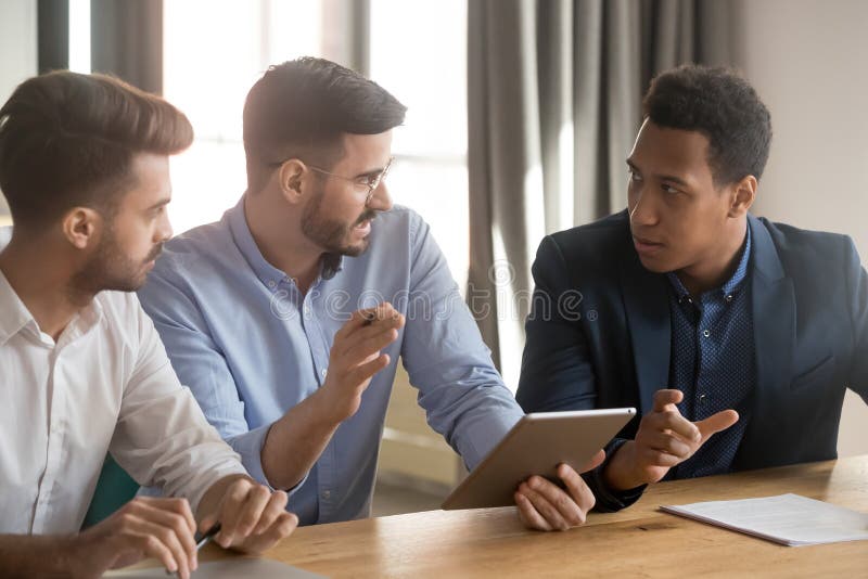 Diverse Colleagues Discuss Business Project Using Tablet Stock Image ... Diverse Colleagues Discuss Business Project Using Tablet Stock Image ...