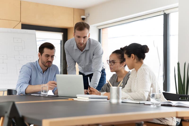 Diverse Colleagues Employees Working on Project Together, Using Laptop ...