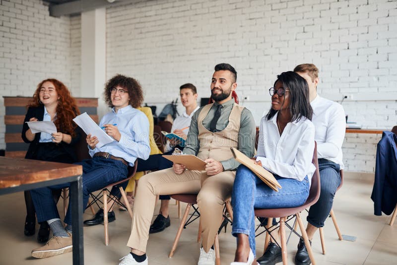 Diverse Colleagues Sit on Business Training with Coach Stock Photo ...