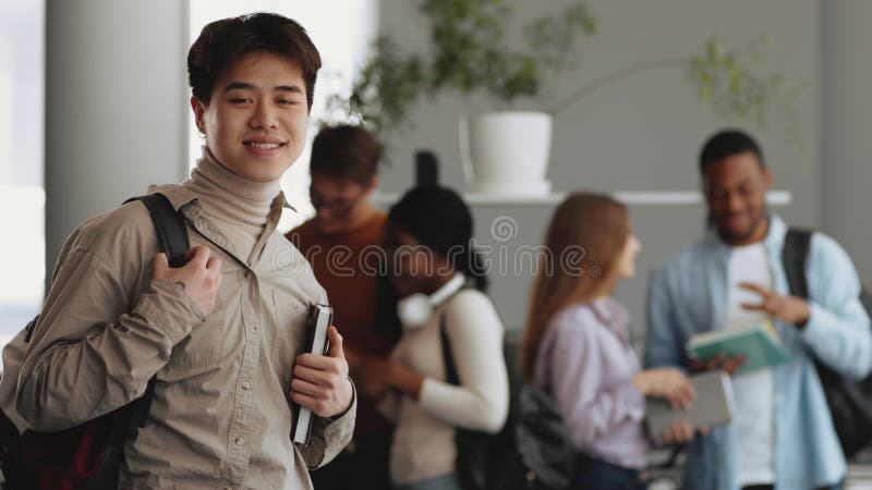 Diverse College Students Engaged in Group Study at a Modern Campus ...