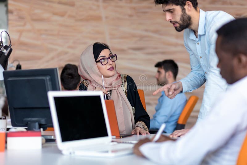 Diverse College Students Using Laptop and Talking, Learning Exchanging ...