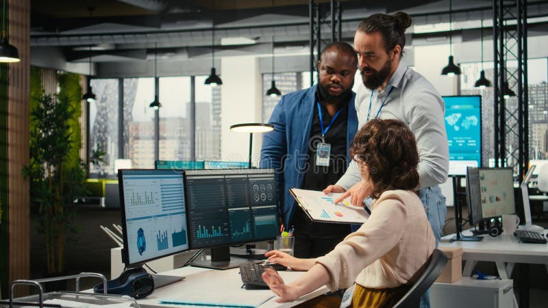 Diverse Corporate Staff Working Together on Report Writing in the ...