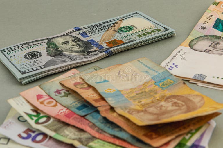Diverse Currencies Arranged on a Table with US Dollars Stock Photo ...