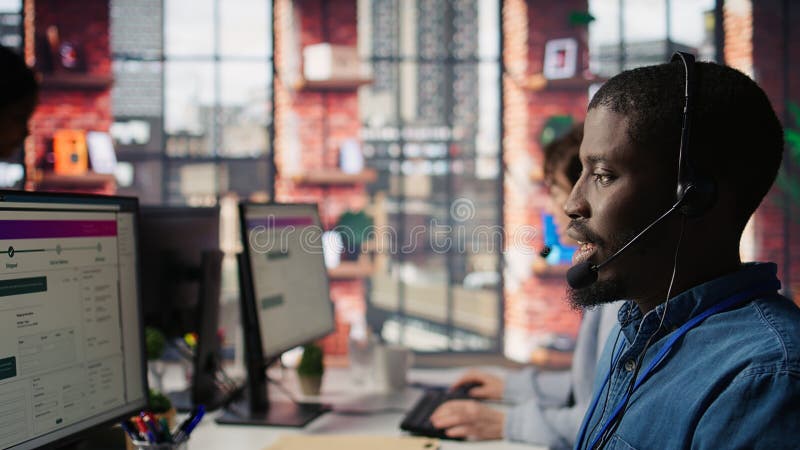 Diverse Customer Center Workers Assisting Clients with Installing ...