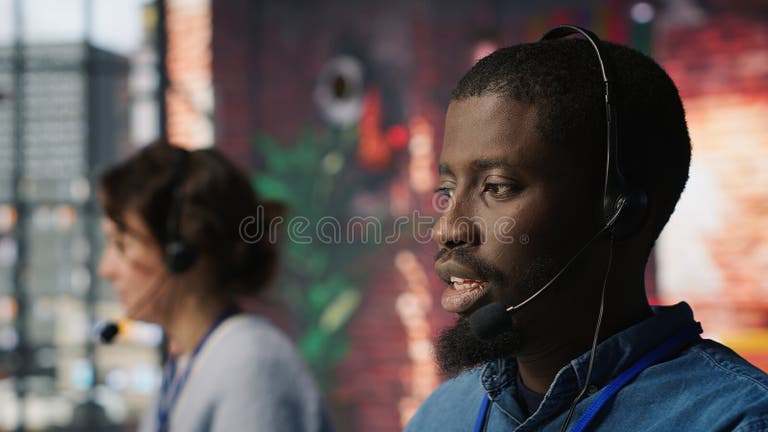 Diverse Customer Center Workers Assisting Clients with Installing ...