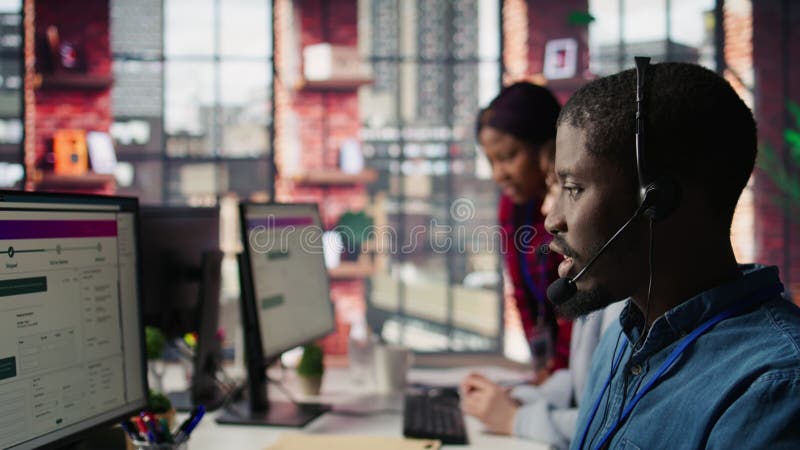 Diverse Customer Center Workers Assisting Clients with Installing ...