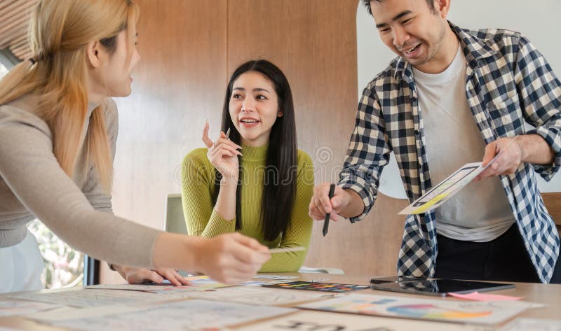 Diverse Design Team Sharing Ideas and Collaborating on Project at ...