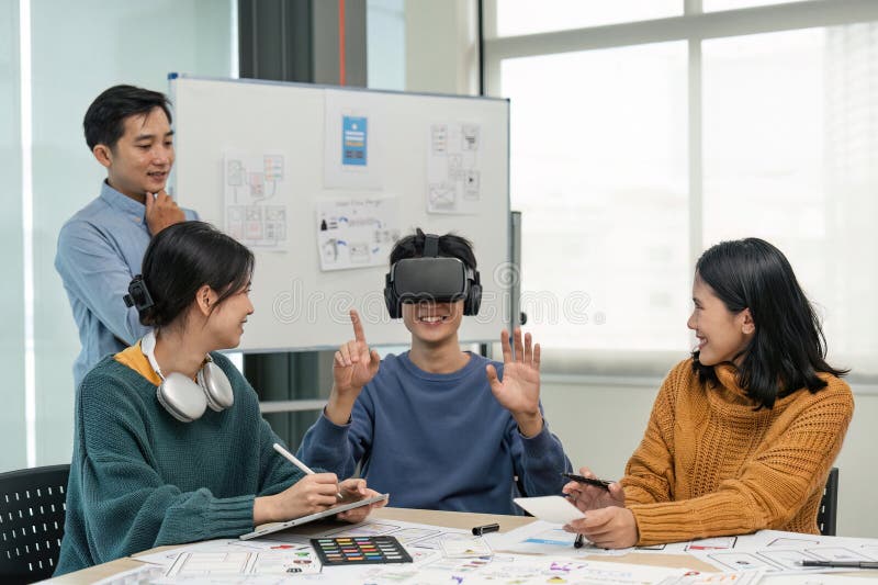 Diverse Development Team Testing Virtual Reality Headset, Brainstorming ...