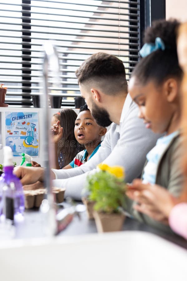 Diverse Elementary Schoolboy and Male Teacher Talking in School Ecology ...
