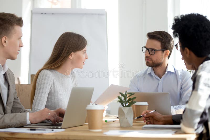 Diverse Employees Sit at Meeting Collaborating in Office Stock Photo ...