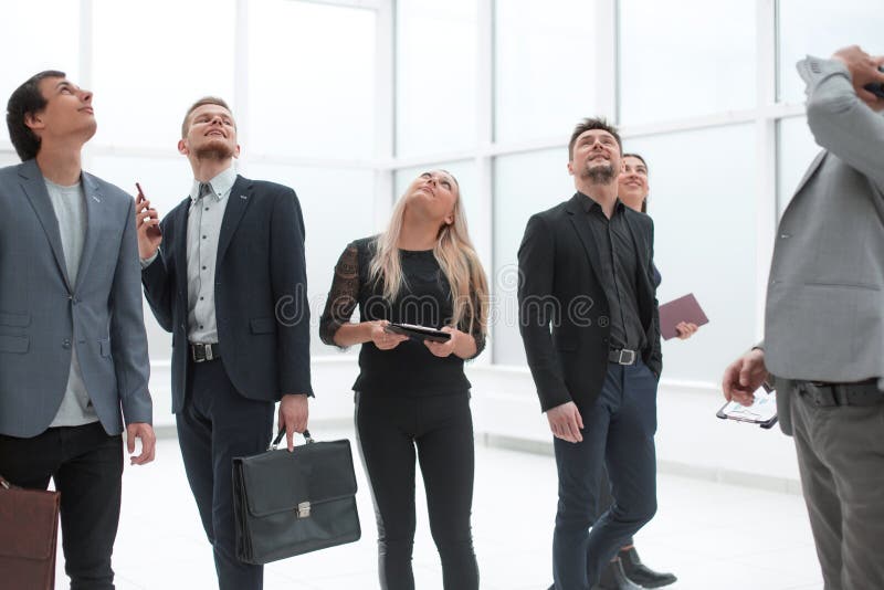 Diverse Employees Standing in the Office and Looking Somewhere Up ...