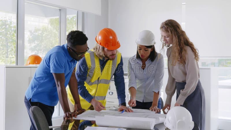 Diverse Engineering Team Meeting To Discuss Architectural Project and ...