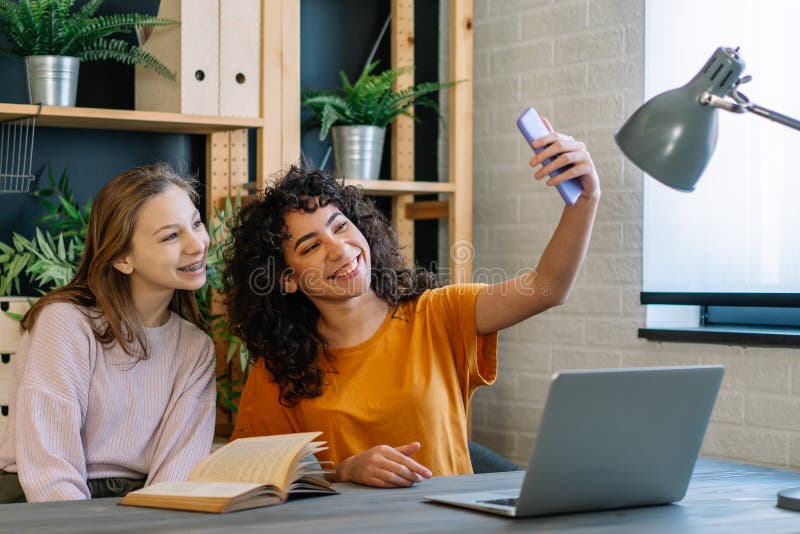Diverse Ethnicity Student Girls, Sisters Using a Digital Gadgets ...