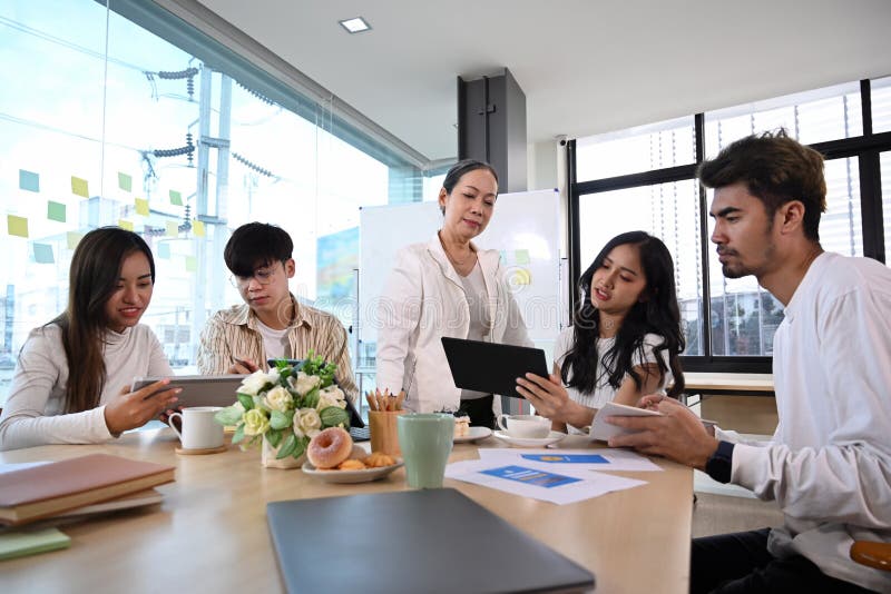 Diverse Executive Managers Discussing New Project Strategy and Working ...