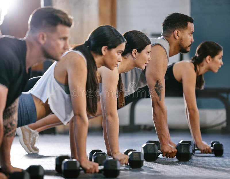 Diverse Group of Active Young People Doing Plank Hold and Push Up ...