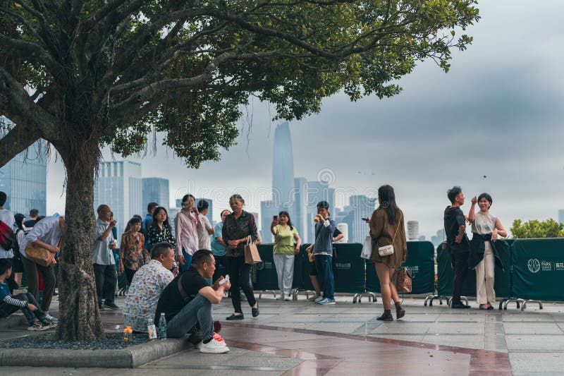 Diverse Group of Adults Standing Together on a City Sidewalk in Front ...