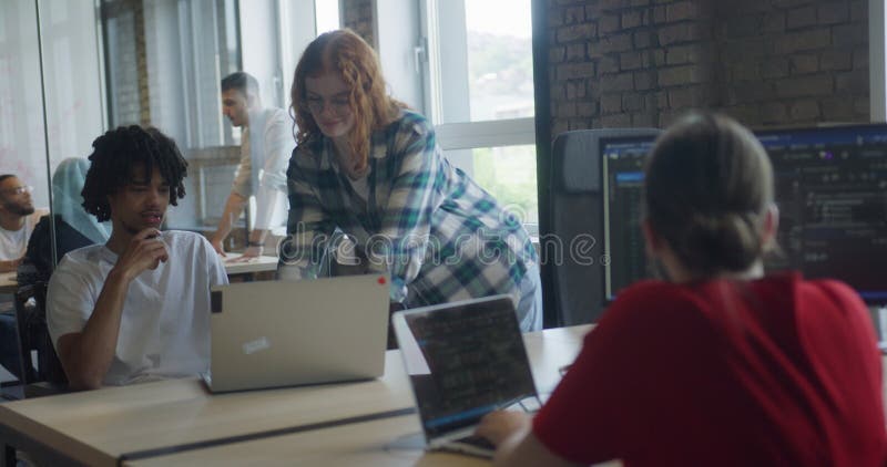 A Diverse Group of Business Colleagues Engage in Discussions about ...