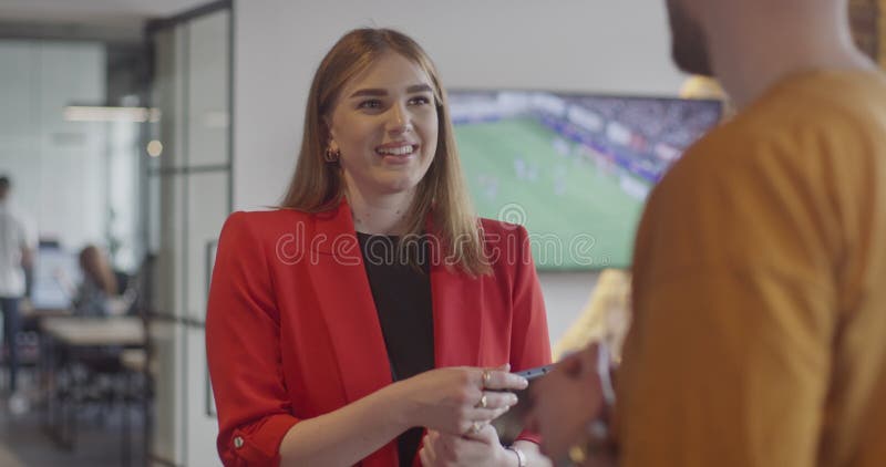 A Diverse Group of Business Colleagues Engage in Discussions about ...