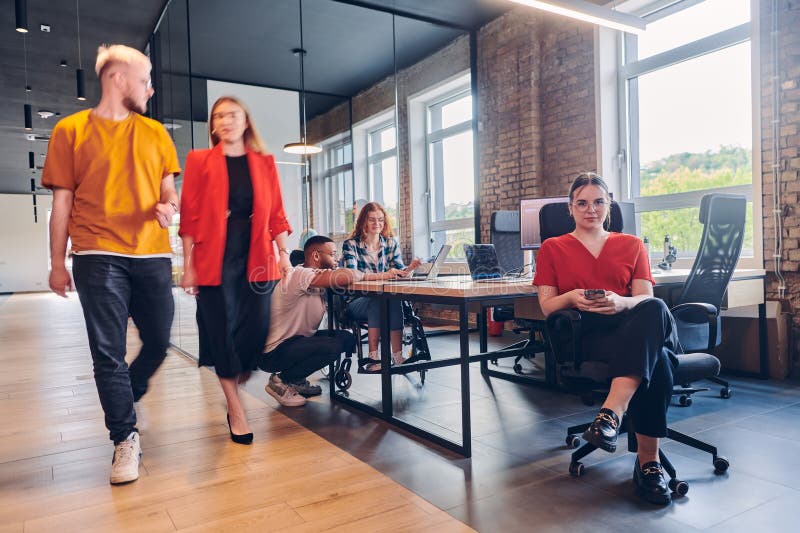 A Diverse Group of Business Professionals Collaborates in a Modern ...