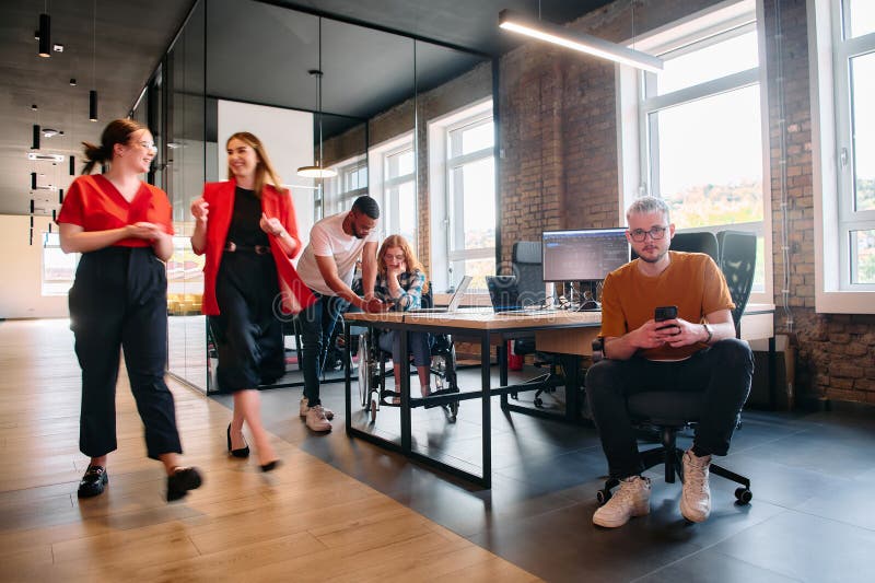 A Diverse Group of Business Professionals Collaborates in a Modern ... A Diverse Group of Business Professionals Collaborates in a Modern ...