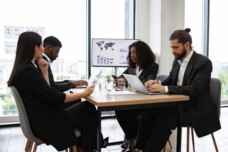 Diverse Business Team Analyzing Data in Modern Office Environment Stock ...