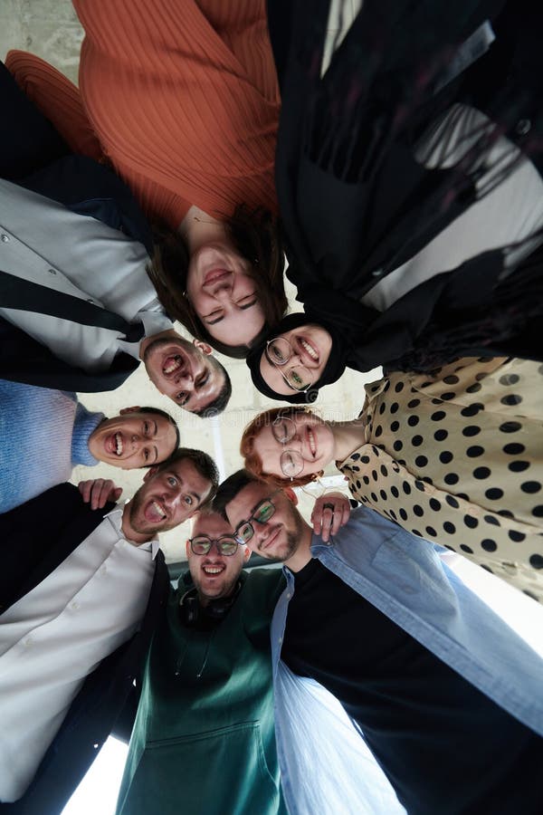 A Diverse Group of Business Professionals Standing Together in a ...