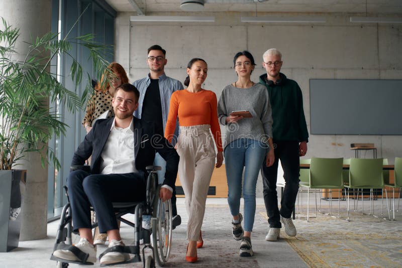 A Diverse Group of Business Professionals Walking Together through the ...