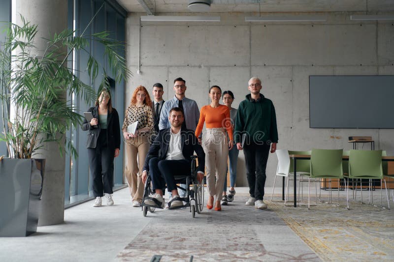 A Diverse Group of Business Professionals Walking Together through the ...