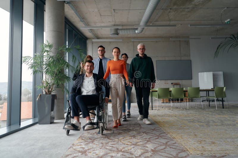 A Diverse Group of Business Professionals Walking Together through the ...