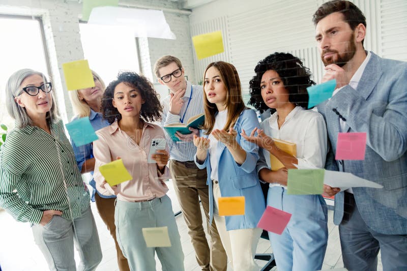 Diverse Group of Businesspeople Collaborating on a Project in a Modern ...