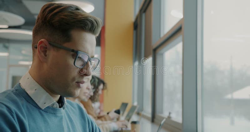 Diverse Group of Businesspeople Working with Laptop Computers Typing ...