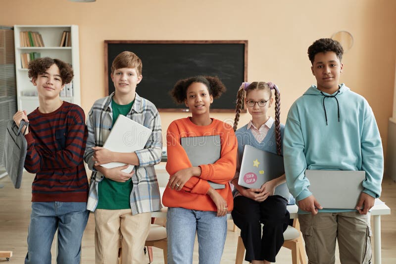 Group of Children Wearing Lab Coats in Science Class at School Smiling ...