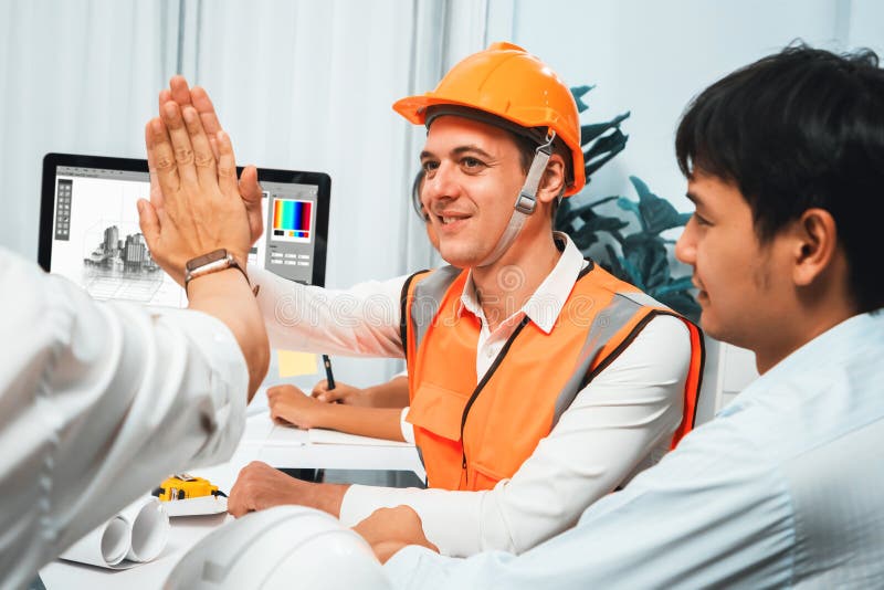 Diverse Group of Civil Engineer and Client Celebrate and High Five ...