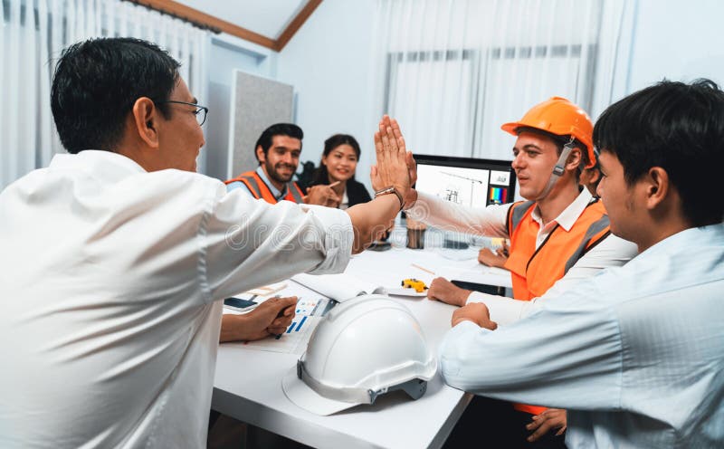 Diverse Group of Civil Engineer and Client Celebrate and High Five ...