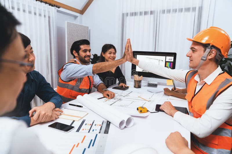Diverse Group of Civil Engineer and Client Celebrate and High Five ...