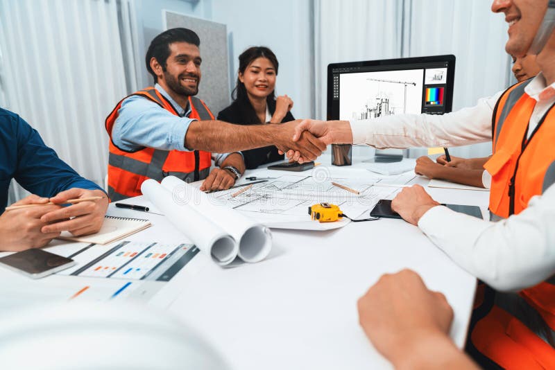 Diverse Group of Civil Engineer and Client Celebrate and High Five ...