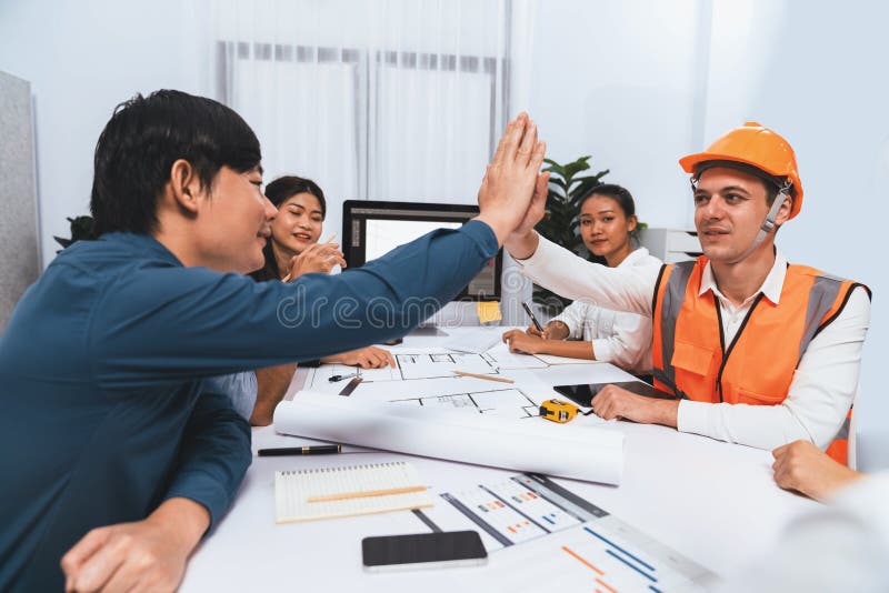 Diverse Group of Civil Engineer and Client Celebrate and High Five ...