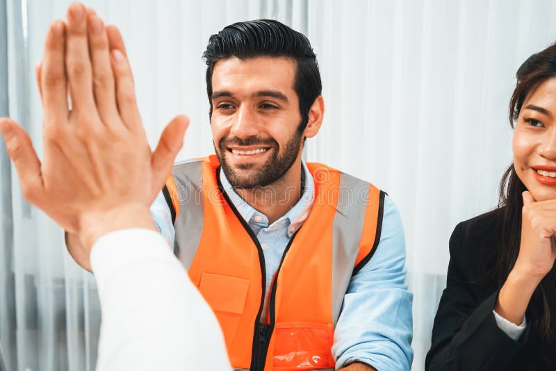 Diverse Group of Civil Engineer and Client Celebrate and High Five ...