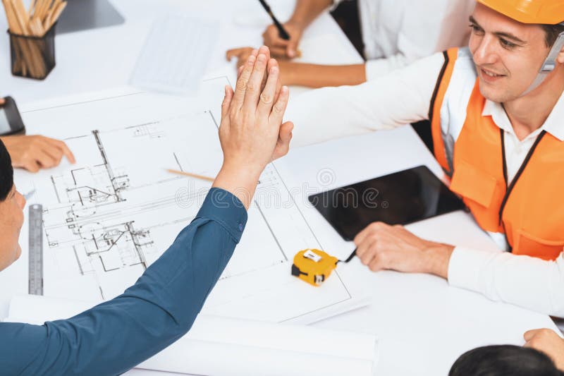 Diverse Group of Civil Engineer and Client Celebrate and High Five ...