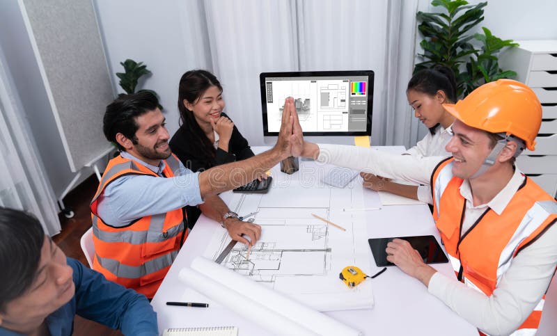 Diverse Group of Civil Engineer and Client Celebrate and High Five ...