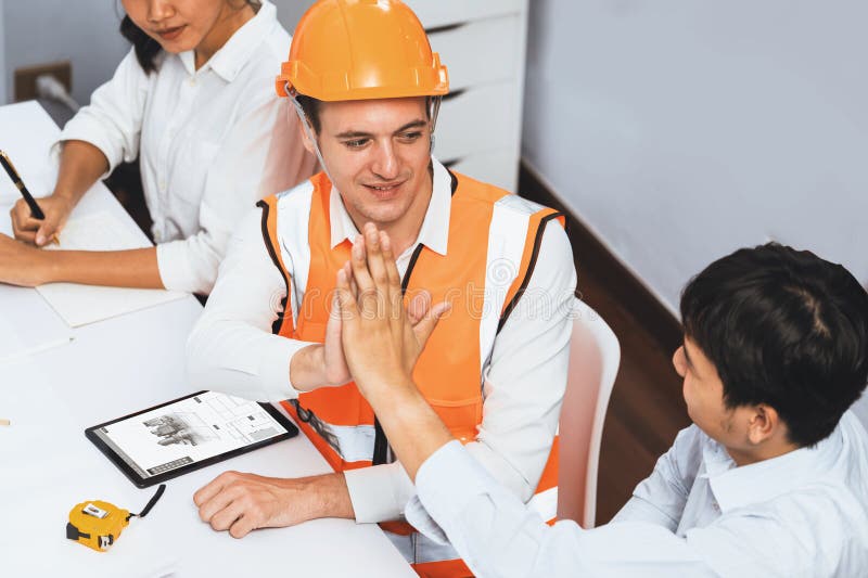 Diverse Group of Civil Engineer and Client Celebrate and High Five ...