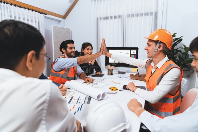 Diverse Group of Civil Engineer and Client Celebrate and High Five ...