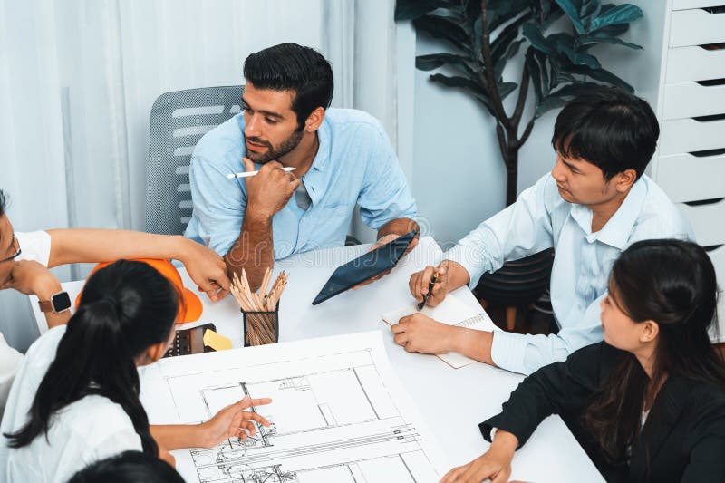 Diverse Group of Civil Engineer and Client Working on Architect ...